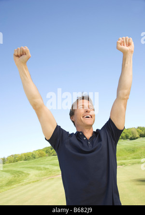 Portrait of cheering white male sports fan holding a bottle Stock Photo ...