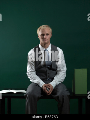 Business man waiting sitting at the desk pointing on you Stock Photo ...