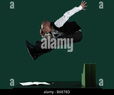 Young Businessman over a desk, full of thoughts, isolated in white ...