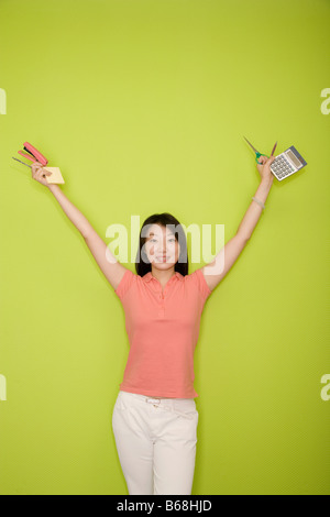 Adult female standing with office stationery, during shopping with man ...