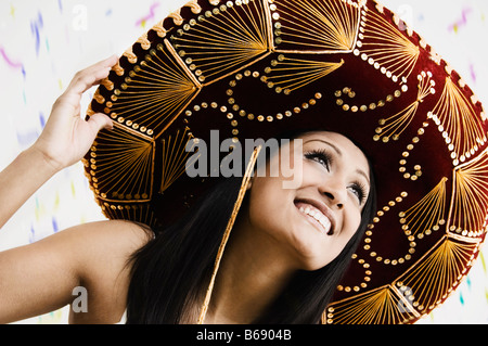 Young mexican woman wearing sombrero isolated on white Stock Photo - Alamy