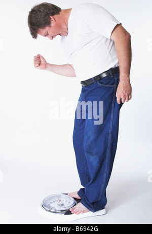 Man standing on weight scales with bare foot - view from top Stock ...