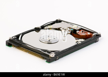Computer hard drive, opened, writing/reading head and hard disk. Binary ...