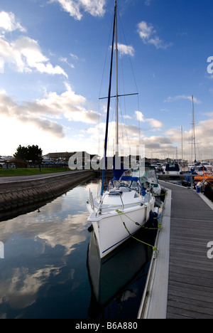 Sailing yacht alongside pontoon in new marina by the ferry terminal ...