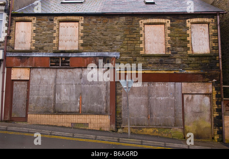 Boarded up closed shops in council estate shopping arcade; Newcastle ...