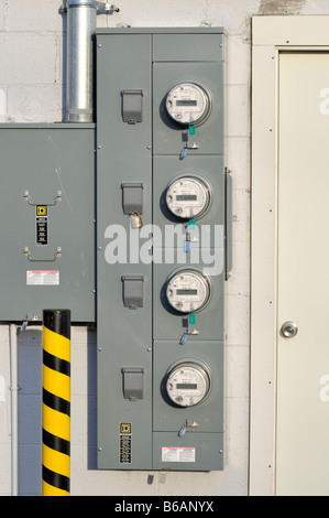 Electric meter box mounted on stone wall with one out of three meters ...