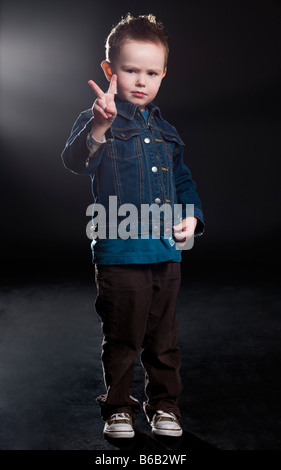 little boy making peace sign Stock Photo - Alamy