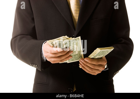 front shot of man counting dollars on wood table Stock Photo - Alamy
