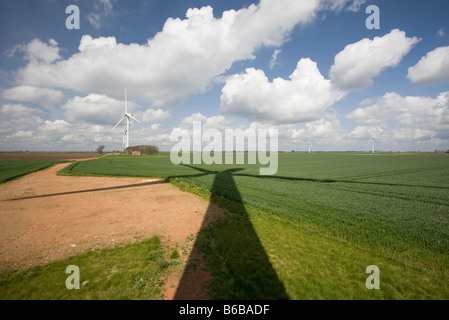 Windmills or wind turbine and shadow on wind farm in rotation to ...