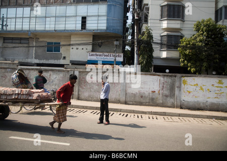 A manual rickshaw puller pulling rickshaw in the street of Kolkata ...