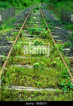 A railroad track running through a rural town Stock Photo - Alamy