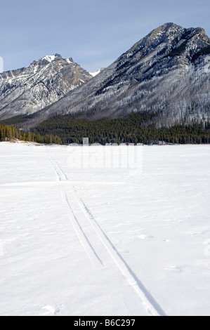Alpine ski tracks on frozen lake, Banff National Park, Banff Alberta ...