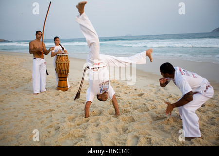Capoeiristas practice Capoeira on Leblon beach in Rio de Janeiro Brazil ...