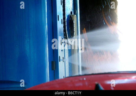 Detail of car wash spray jets with fan of water Stock Photo - Alamy