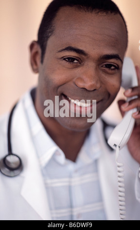 Male doctor making telephone call Stock Photo - Alamy