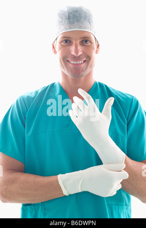 Surgical clothing. Pre-operative hygiene in which a surgeon is helped ...