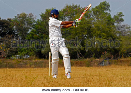 A cricket batsman playing a pull shot towards the boundary in a Stock ...