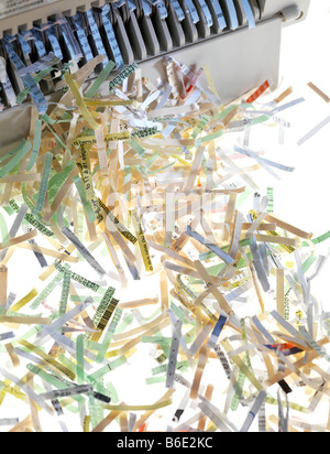 A close-up view of a paper shredder with paper going inside Stock Photo ...