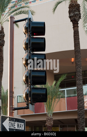 red traffic light with one way sign under blue sky Stock Photo - Alamy