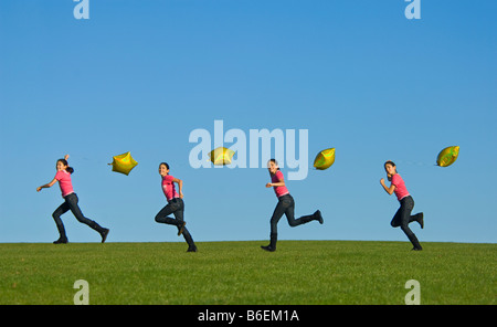 A sequence image of a young girl (11) running happily across green ...