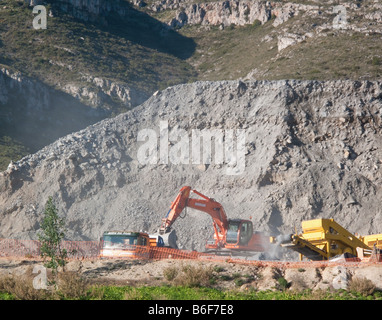 Front end loader loading road salt for de-icing winter roads in Canada ...
