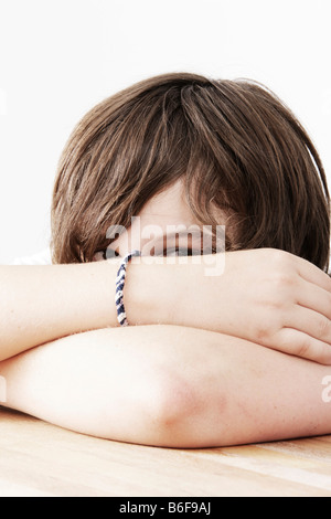 Boy, 14, hiding behind his arms Stock Photo - Alamy