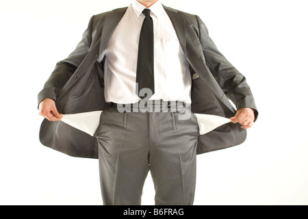 Businessman turning his pockets inside out Stock Photo - Alamy