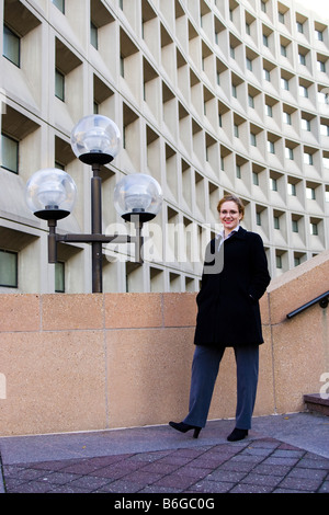 Adult professional woman standing in bicycle shop Stock Photo - Alamy
