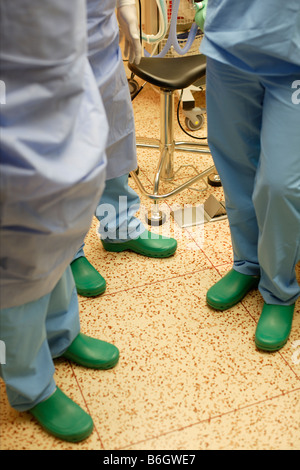 Surgery. Surgeons are working. View from behind the operating room door ...