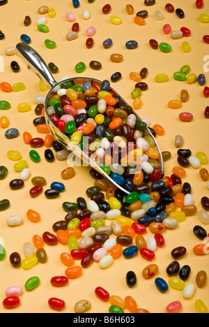 Mass jelly beans spill from scoop Stock Photo - Alamy