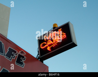 A Mini Cab Sign Stock Photo - Alamy
