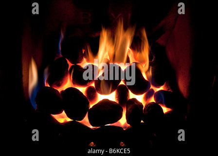 A gas coal effect fire burning in a grate Stock Photo - Alamy