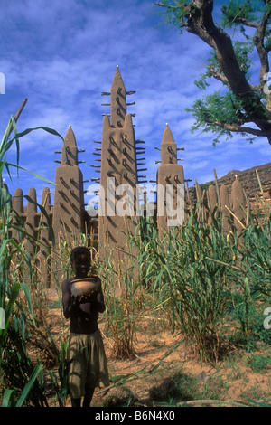 MALI, Dogon Country. African boy proudly showing the yellow bird he ...
