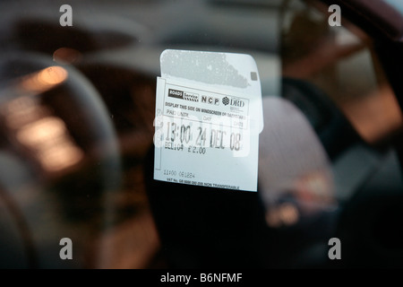 Pay and display parking ticket displayed on a car dashboard with have ...