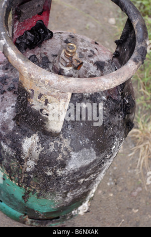 Damaged cooking gas cylinder caused by fire Stock Photo - Alamy