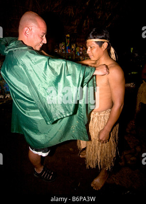Visitors exchange traditional greeting with Maleku Indian member of ...