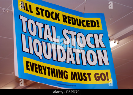 everything must go total liquidation closing signs in a store in ...