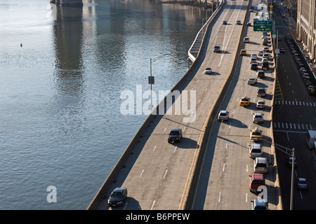 Cars are seen on the FDR Drive on the east side of Manhattan in New ...