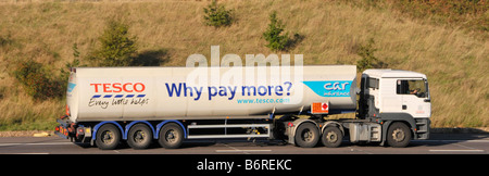 Tesco supermarket articulated petrol tanker trailer behind lorry truck ...