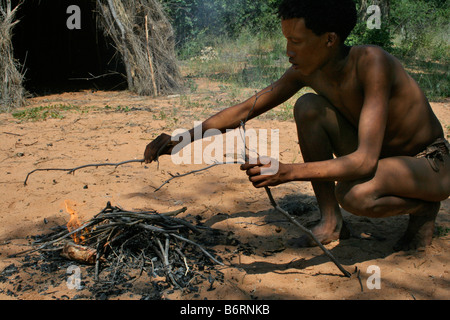 Man starting a fire Stock Photo - Alamy