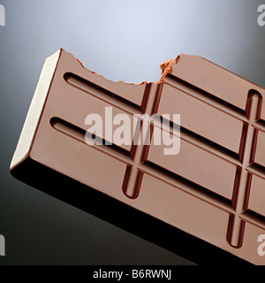 Bitten off chocolate bar Stock Photo - Alamy