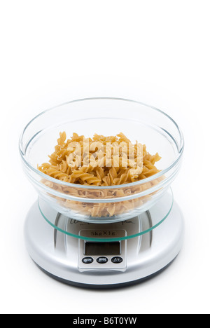 bowl of dried pasta being weighed on a set of scales Stock Photo - Alamy