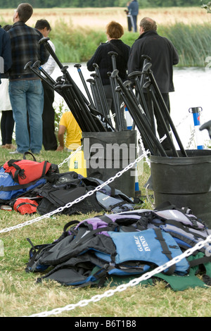 Dragon boat oars and life jackets Stock Photo - Alamy