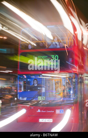 A London Bus at night outside Kings Cross London UK Stock Photo - Alamy
