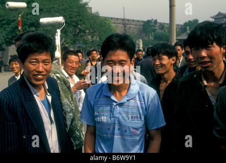Happy Chinese construction workers workmen labourers laborers hauling ...