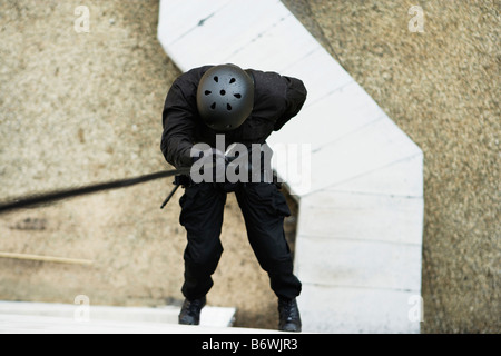 SWAT Team Officer Rappelling from Building Stock Photo - Alamy