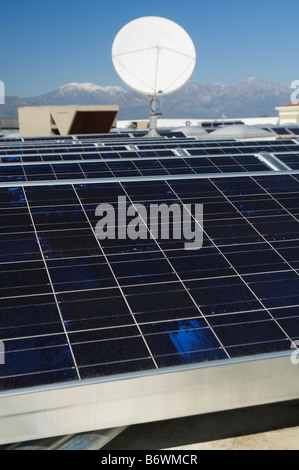 Solar panels and satellite dish at solar power plant Stock Photo - Alamy