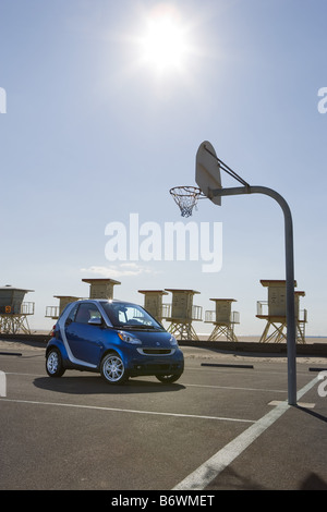 Smartcar parked on basketball court at beach Stock Photo - Alamy