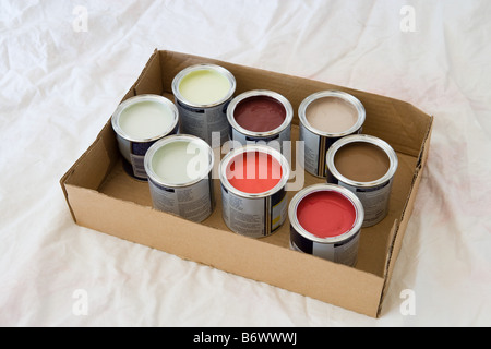 Multi-colored paint in cans on blue background. Palette of colors ...