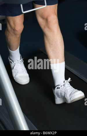 Older man with one leg walking Stock Photo - Alamy